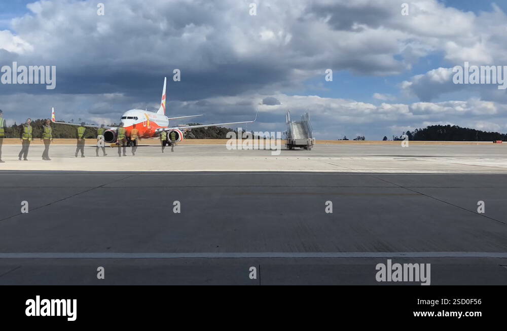 View of the unloading of passengers from the airliner at the airport in ...