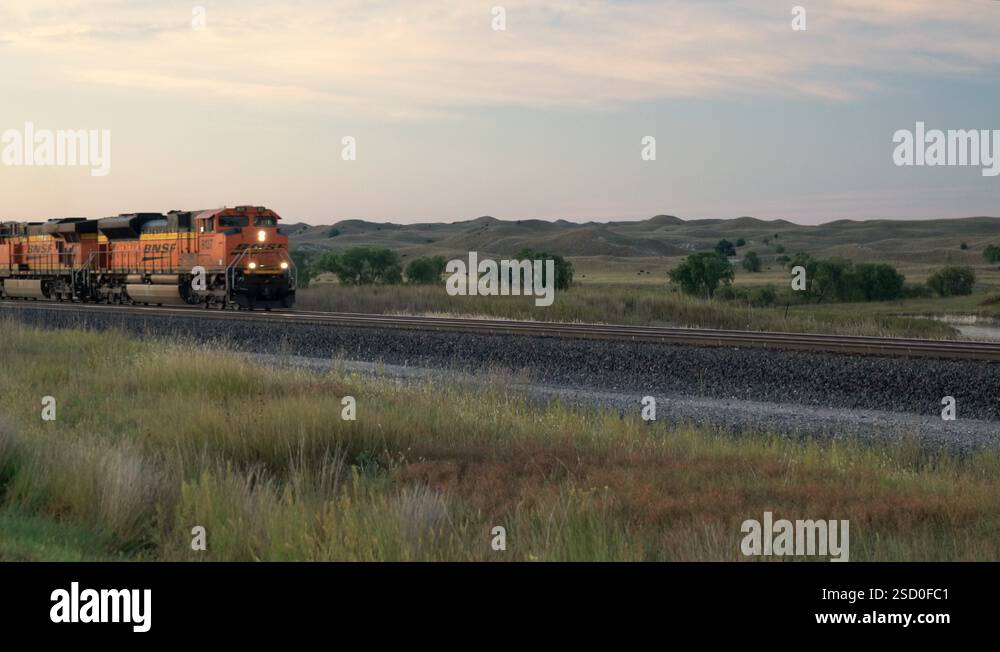 Empty BNSF coal train running at dawn west to Wyoming through Nebraska Sandhills Stock Video ...