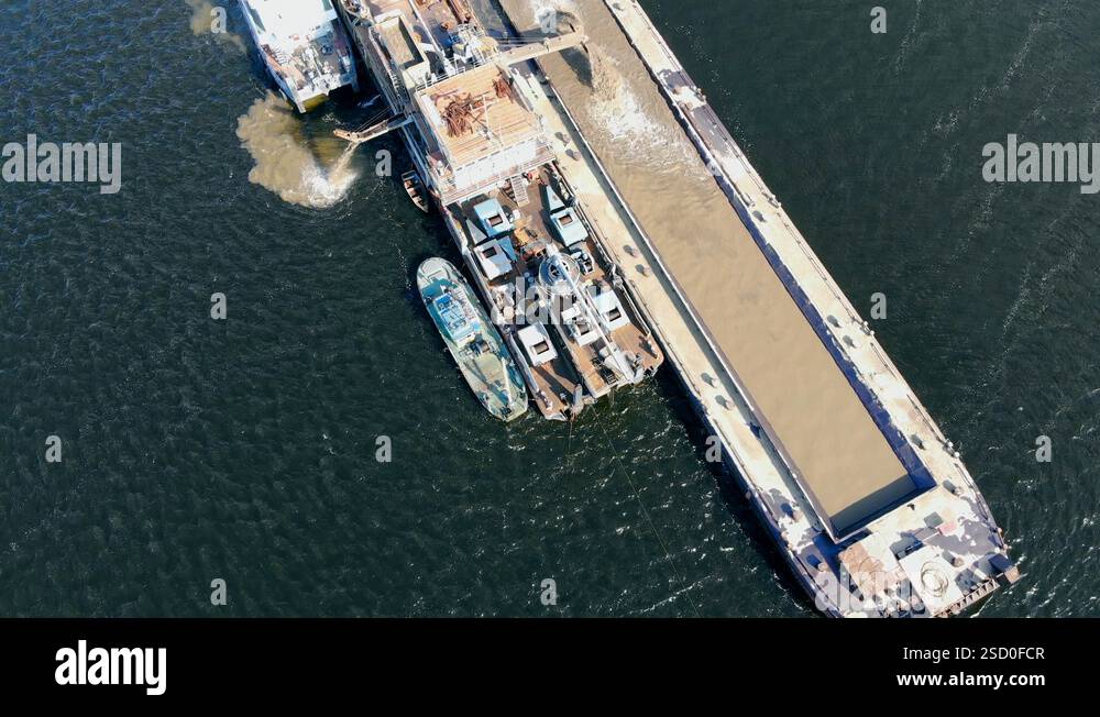 A barge works on river, extracting sand Stock Video Footage - Alamy