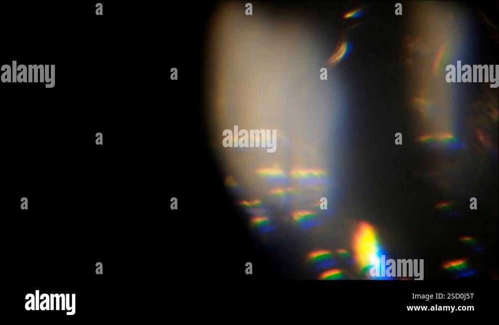 real lens flare bokeh flecks black background Stock Video Footage - Alamy