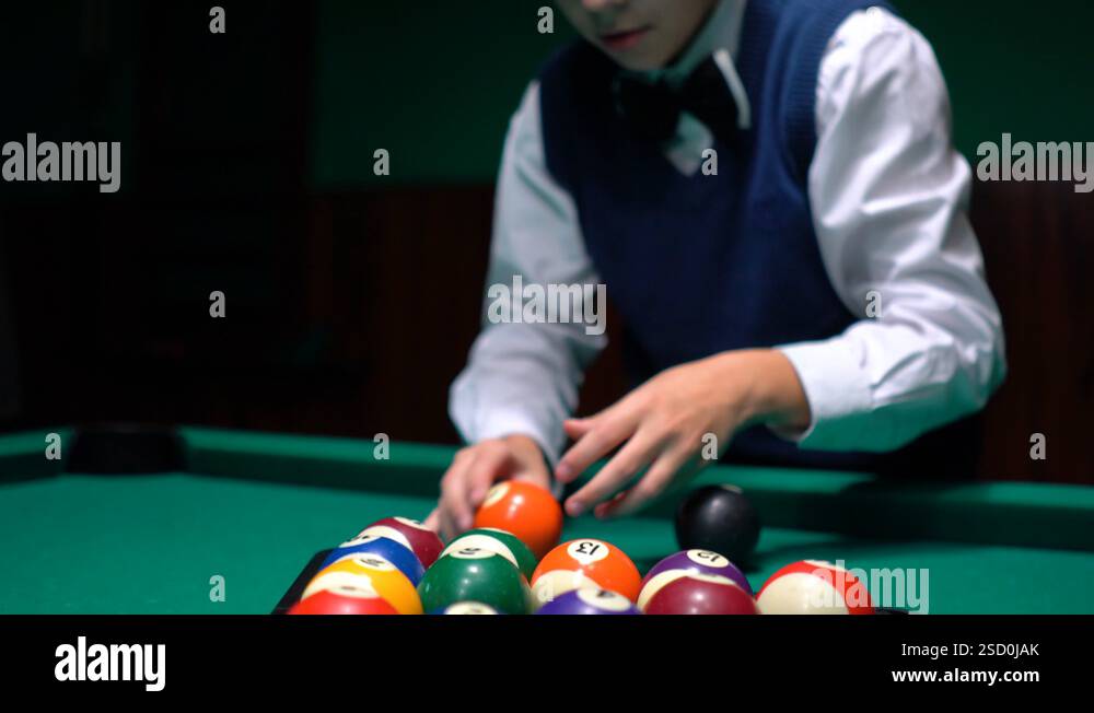 American pool, swimming pool for nine balls. The boy plays billiards ...