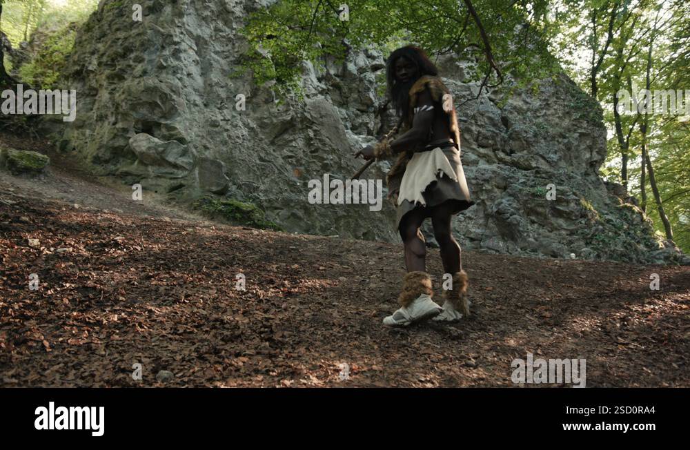 Primitive caveman of african ethnicity dancing a fun futuristic dance ...