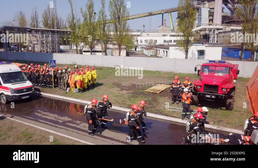 Rescuers carry a victim during a disaster Stock Video Footage - Alamy