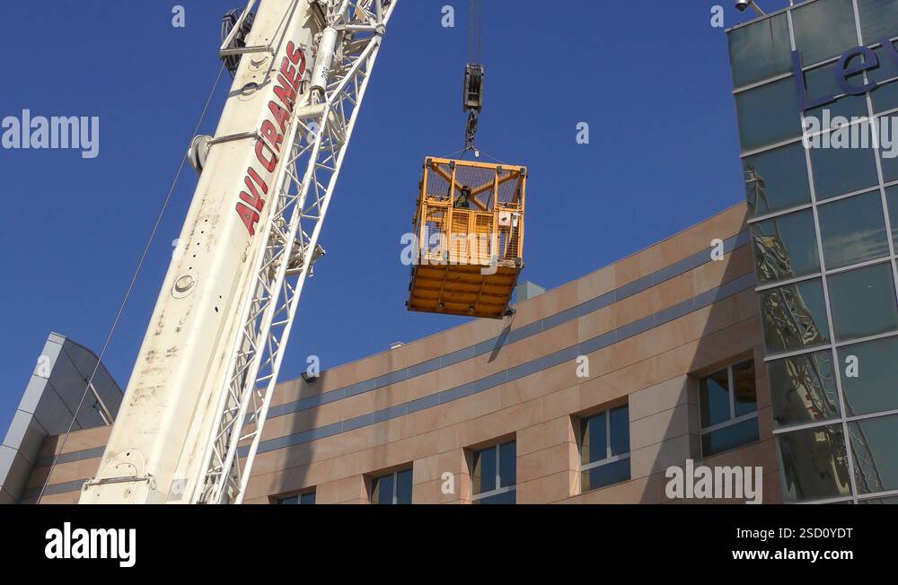 Homeland security soldiers use a crane for the evacuation of patients ...