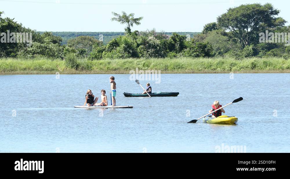 Children at lake kayaking in group at river Stock Video Footage - Alamy