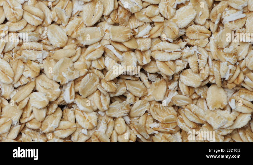 Close-up Oat flakes rotating top view. Macro organic food background 4k ...