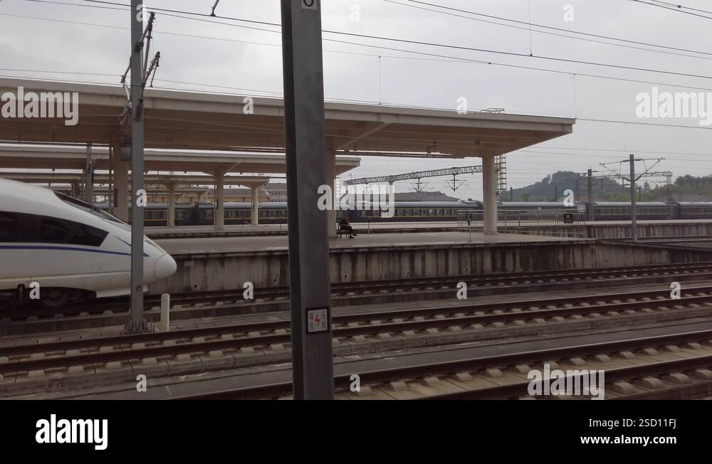 Very long high speed rail train outside ready to leave at the station ...
