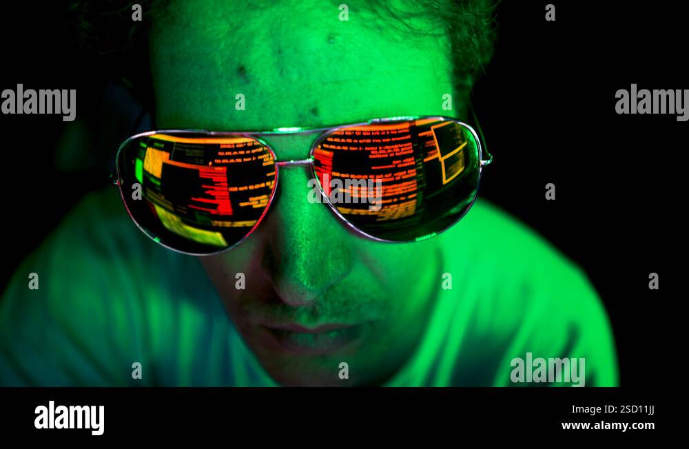 Hacker's glasses reflecting malicious code on screen Stock Video Footage - Alamy