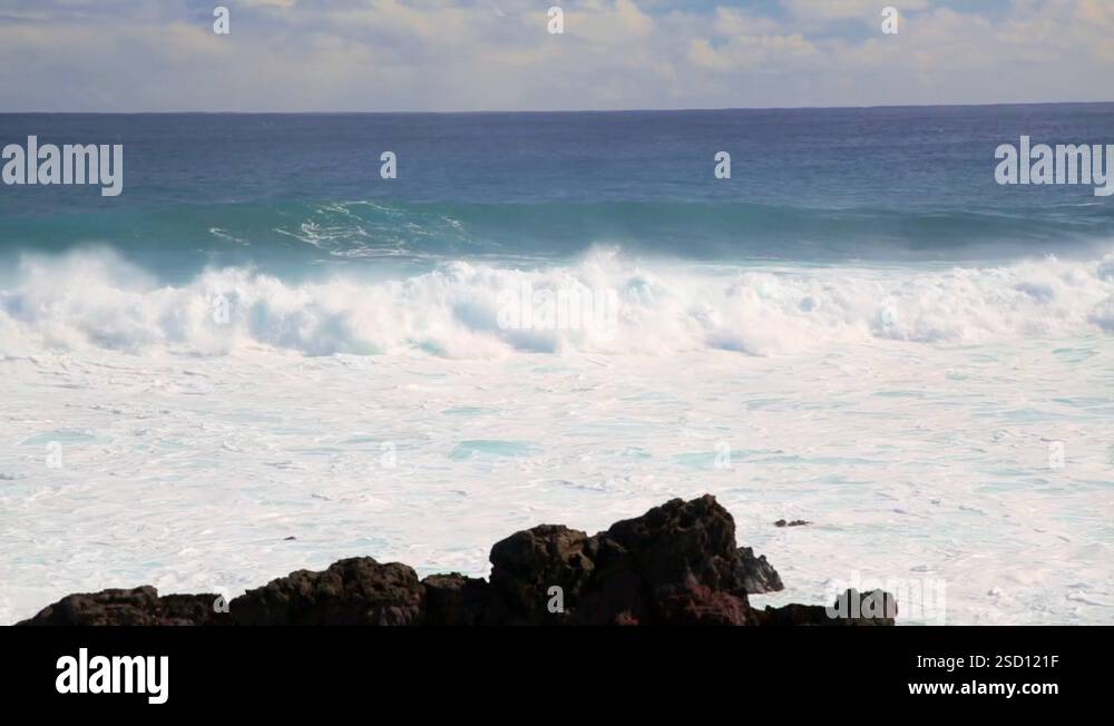 Waves crashing at the coastline and dropped back into the next ...