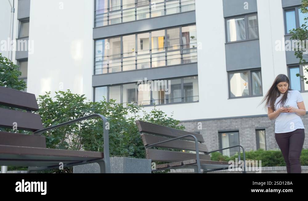 Negative emotions to the smartphone, the woman is angry at the idle ...