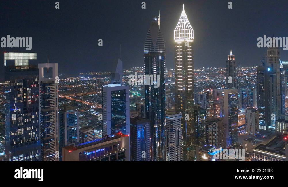 Skyline of the buildings of Sheikh Zayed Road and DIFC aerial night ...