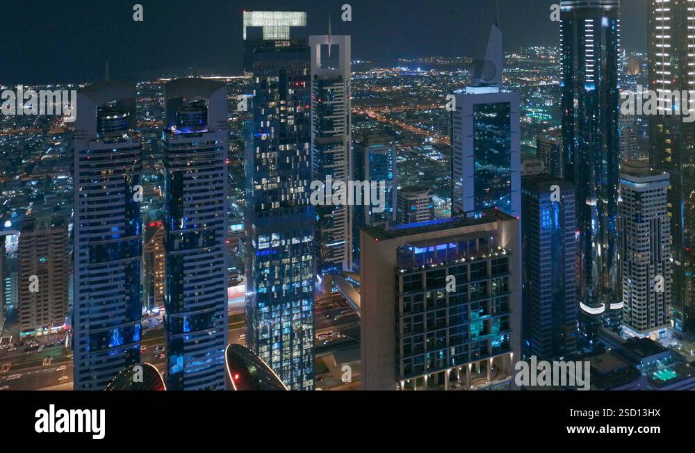 Skyline of the buildings of Sheikh Zayed Road and DIFC aerial night ...