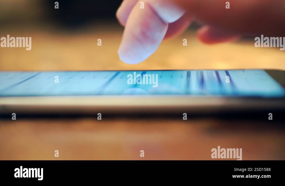 finger clicks on the glass screen of a modern digital device Stock ...