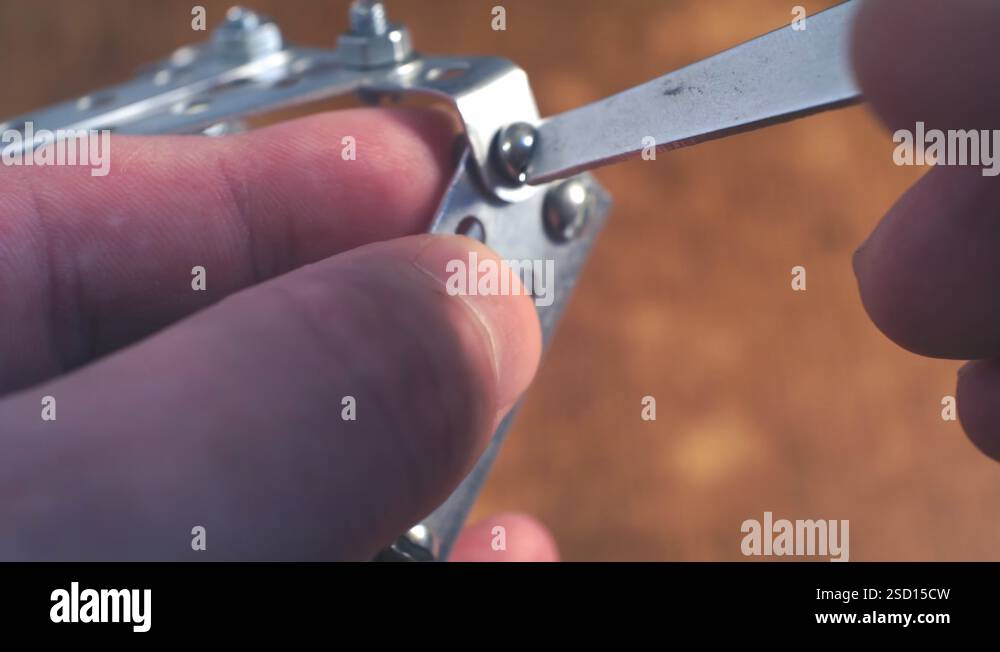hand tightens the bolt with a special screwdriver Stock Video Footage ...