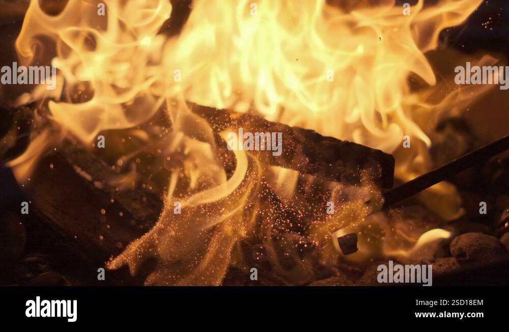 Wood Burning On Fire. Red Fire sparks are flying up. Burning glowing ...