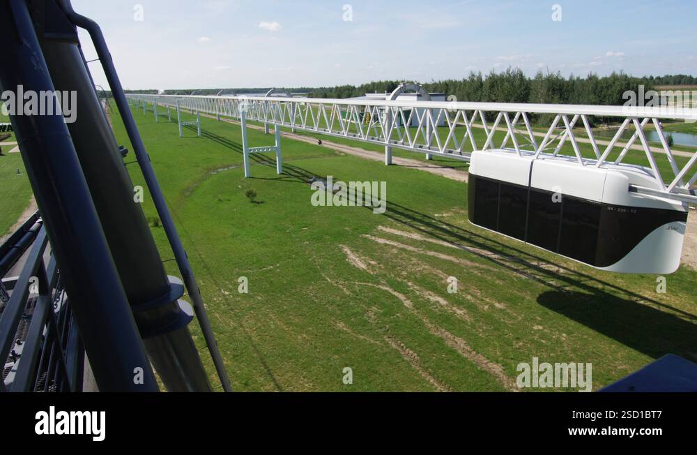 unibus transport drives along overpass railway over meadow Stock Video ...