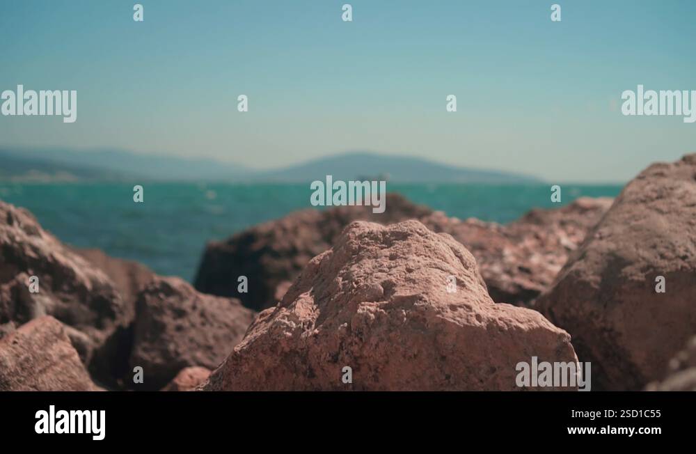 Rocky seashore in a storm. Waves on the seashore on a stormy day. The ...