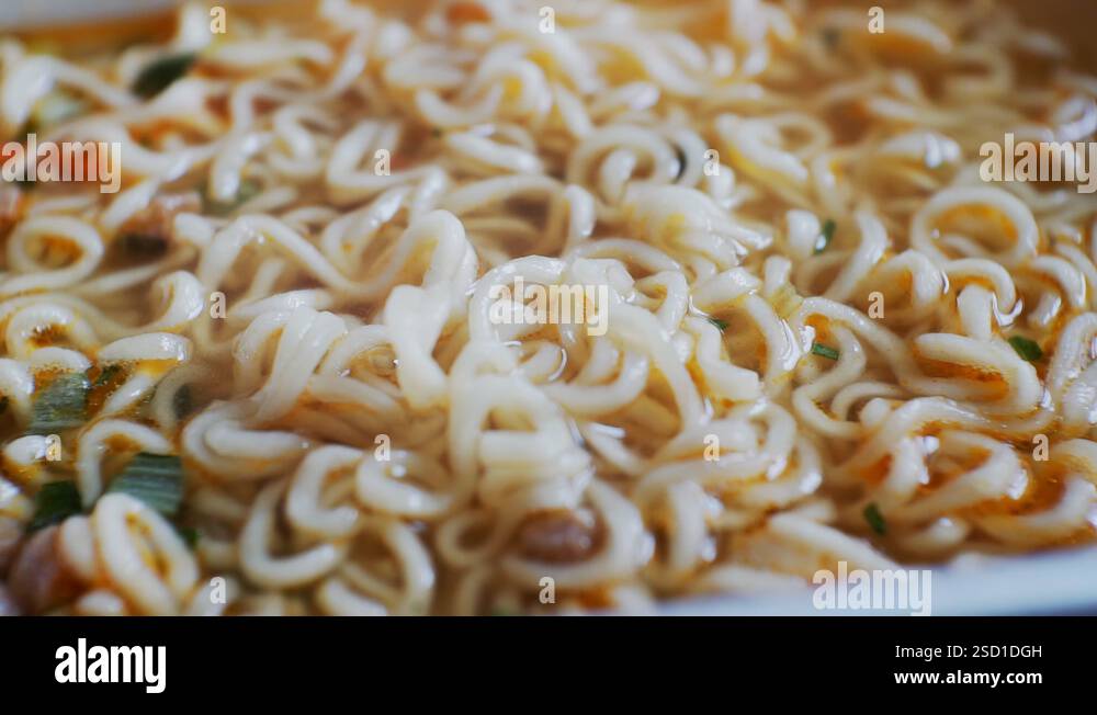 unhealthy food.dry instant noodles in a broth with spices Stock Video ...