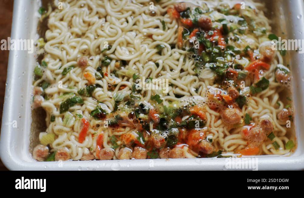 unhealthy food.dry instant noodles in a broth with spices Stock Video ...