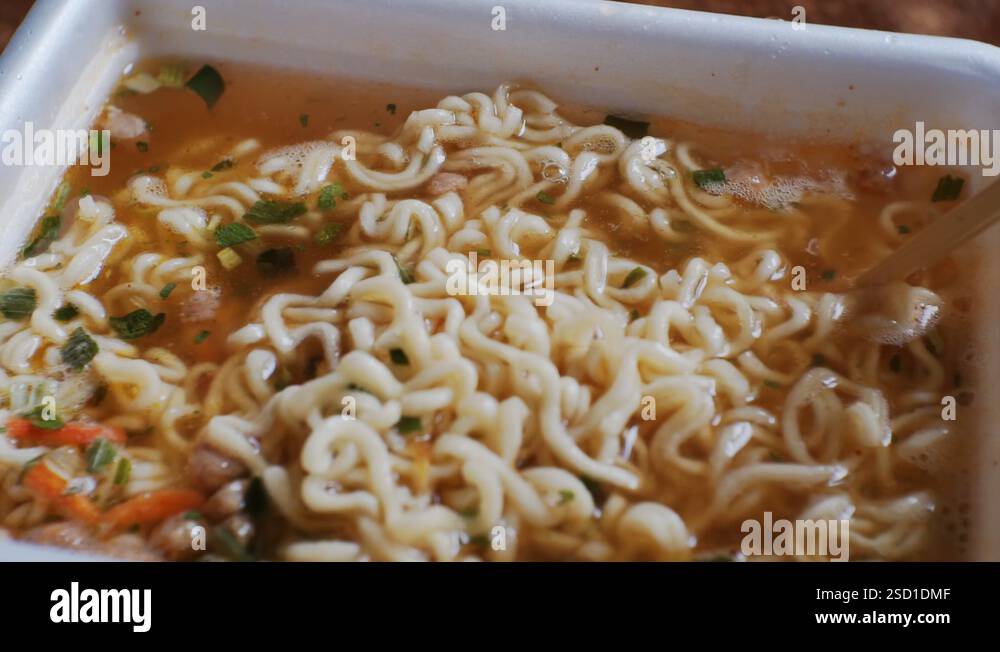unhealthy food.dry instant noodles in a broth with spices Stock Video ...