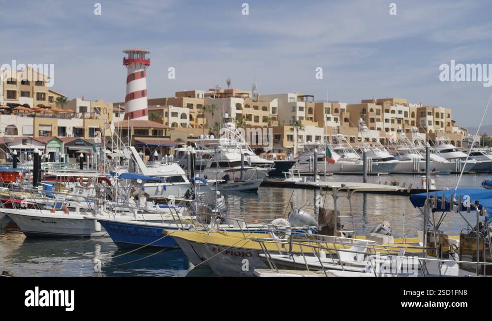 Cabo marina zoom in boats dock hotels and lighthouse RED 4K slowmo ...