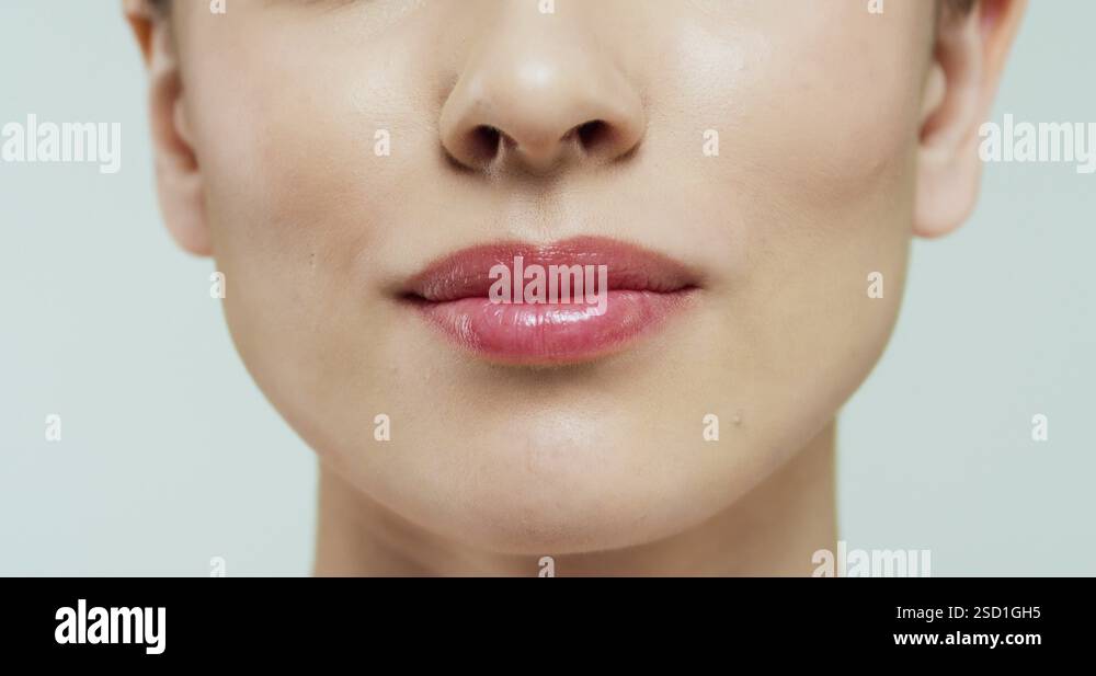 Close up of the bottom part of the female face, mouth and nose of the ...