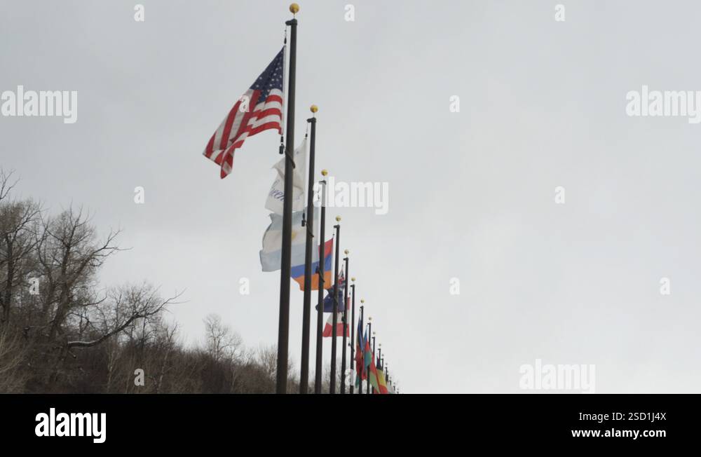Flags at Beaver Creek ski resort windy in winter tilt down RED 4k ...