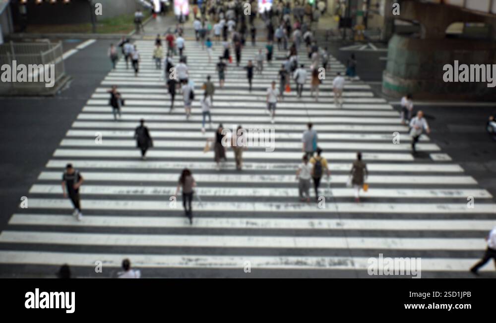 JAPAN : Aerial blurred view of zebra crossing. Crowd of people at the ...