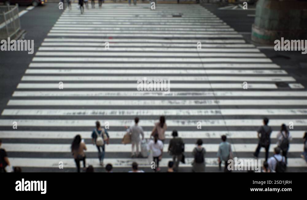 JAPAN : Aerial blurred view of zebra crossing. Crowd of people at the ...