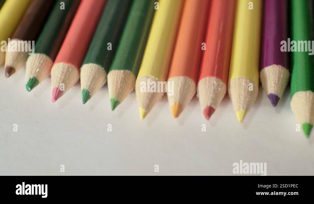 colored pencils of different colors lying on a light surface Stock ...