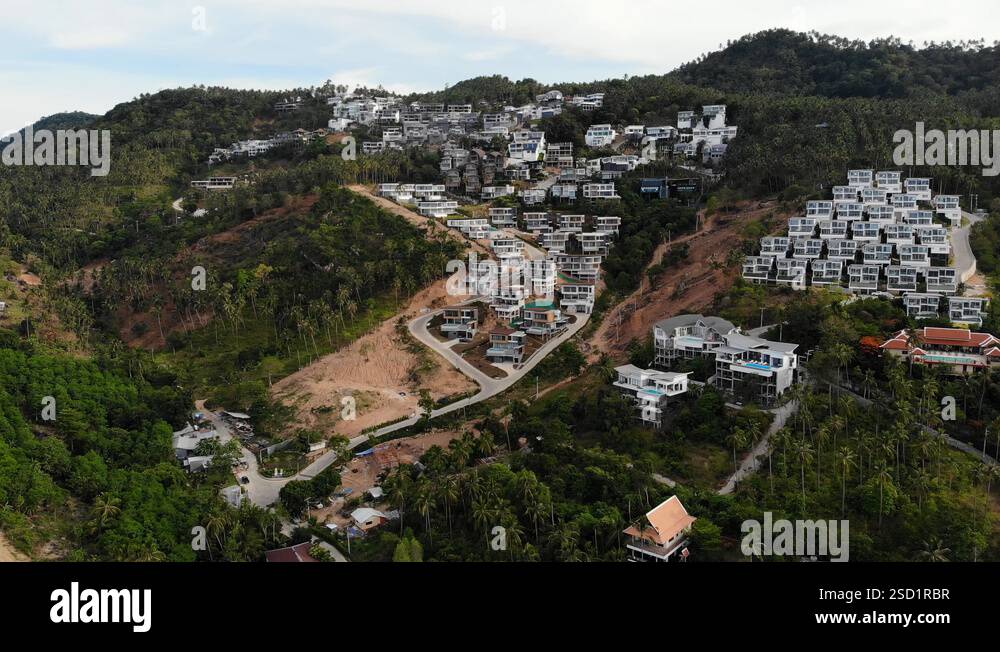 Tropical terrain covered with endangered forests and luxury villas ...