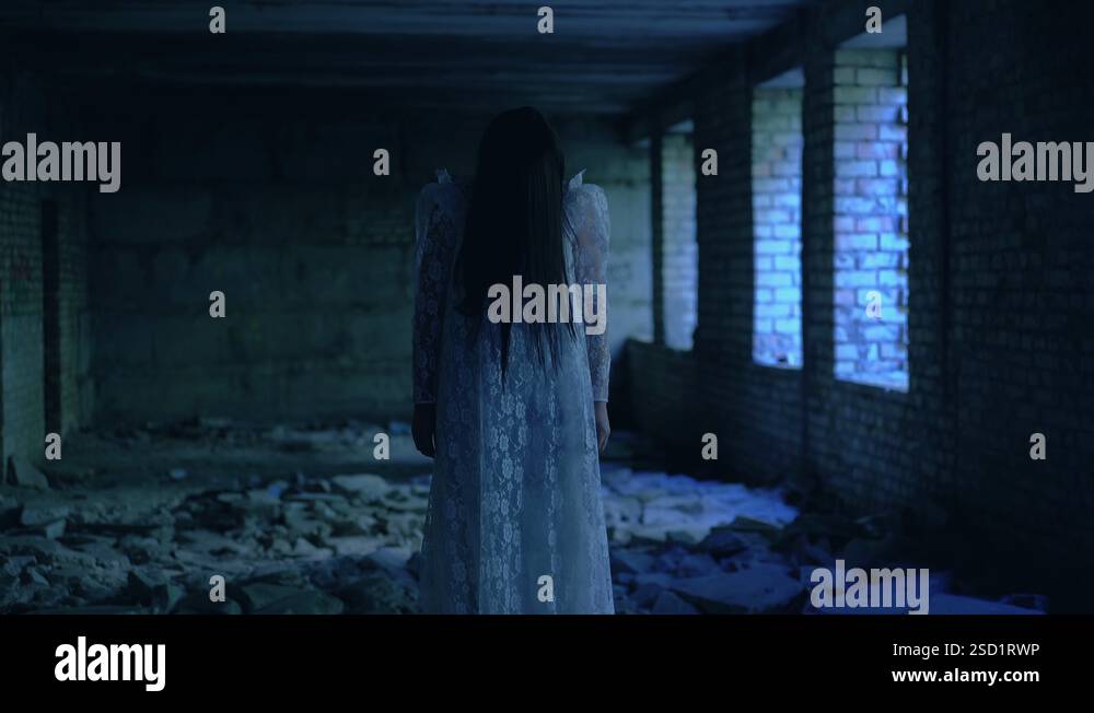 Terrifying ghost of dead bride glowing in dark abandoned building ...