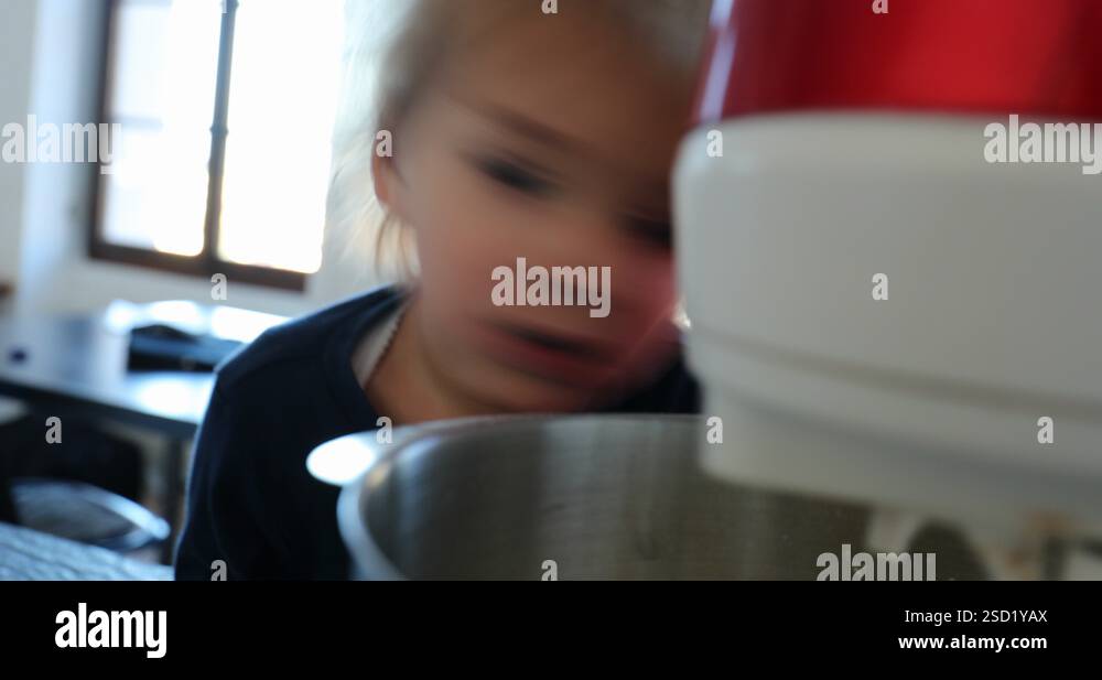 Toddler baby boy shaking his head in a fun way, happy child dancing to ...