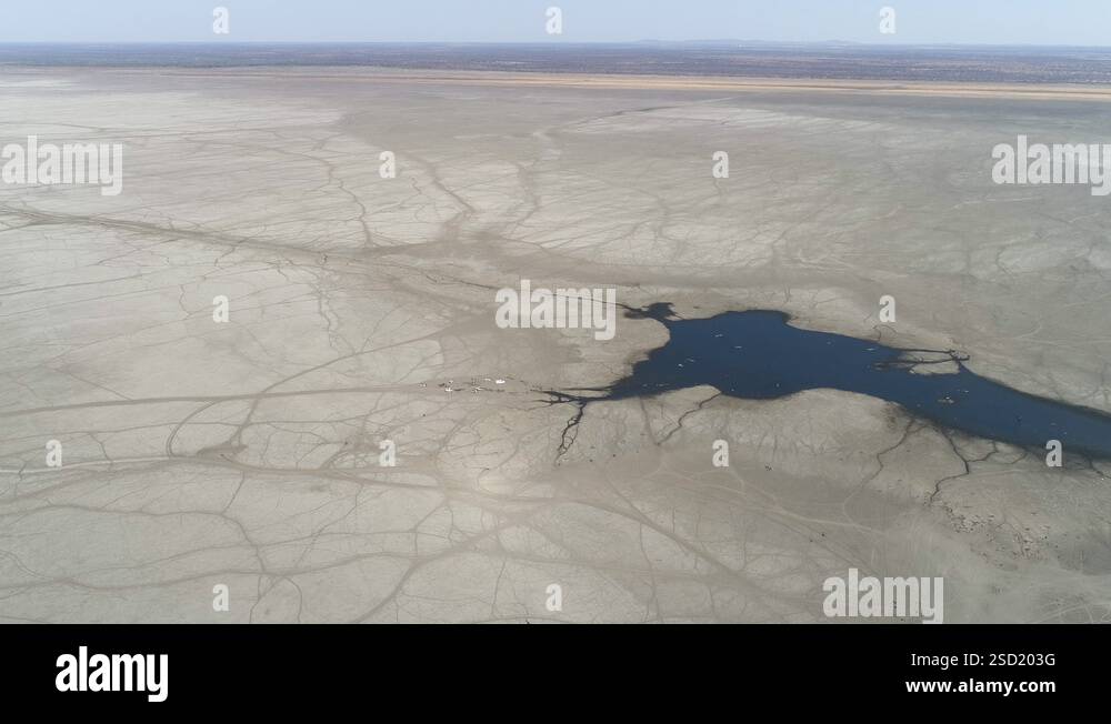 level of devastation of a drying up lake due to drought and climate ...