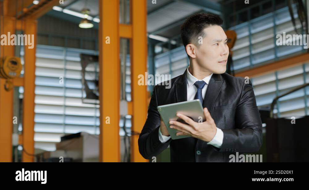 Business man using tablet for work at factory Stock Video Footage - Alamy