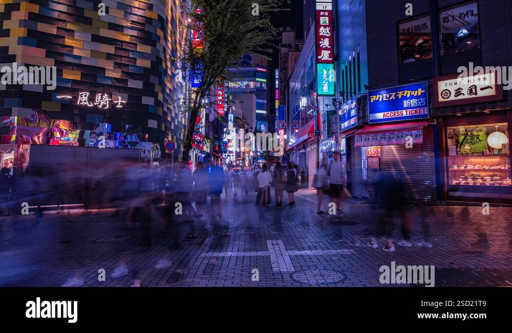 A night timelapse of the neon town in Setagaya Tokyo wide tilt Stock ...