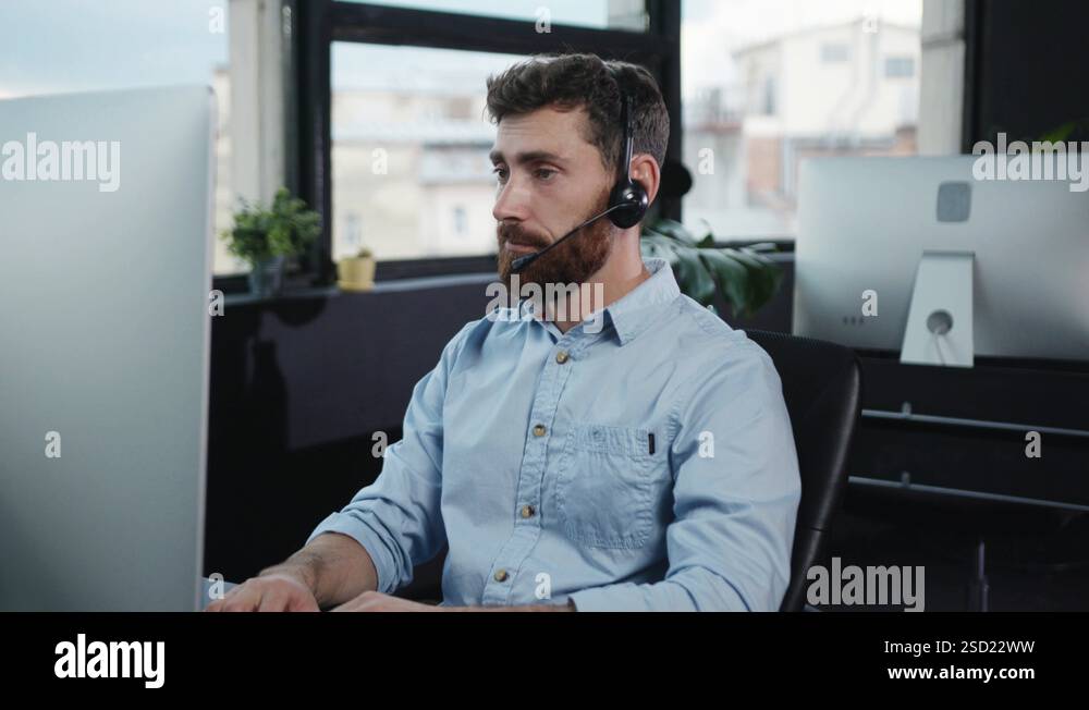 Bored young customer service executive talking with client on ...