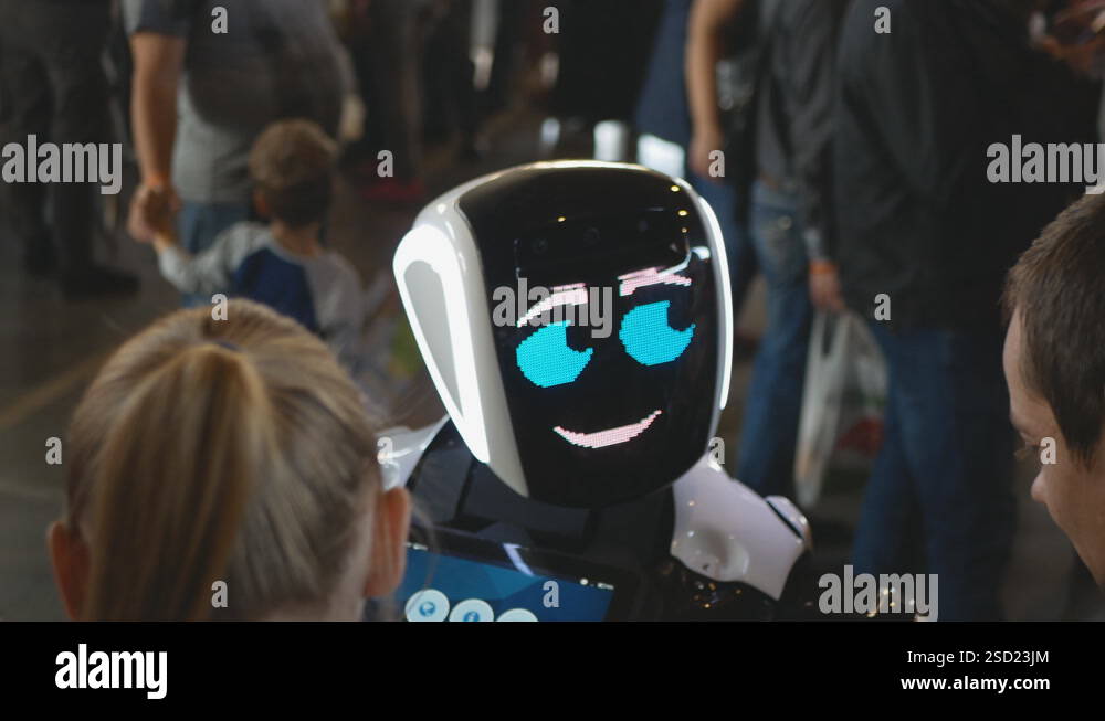 Android,robot communicates with people. Cyborg among people Stock Video ...