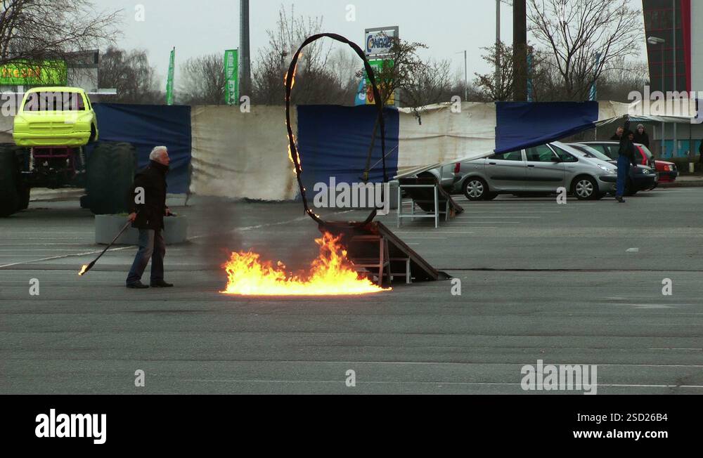 Stunt show, Motorcycle jumping through a ring of fire, slow motion ...