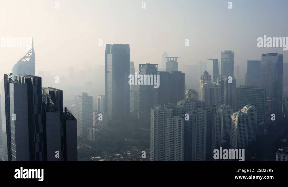 Air pollution covering buildings in the city Stock Video Footage - Alamy