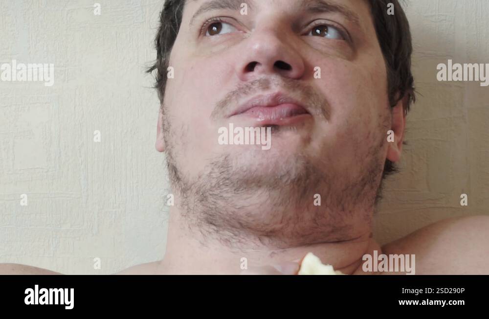 portrait of a man who chews a ripe apple Stock Video Footage - Alamy