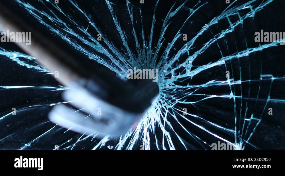 Shattering glass screen with a hammer. Breaking and cracking screen on ...