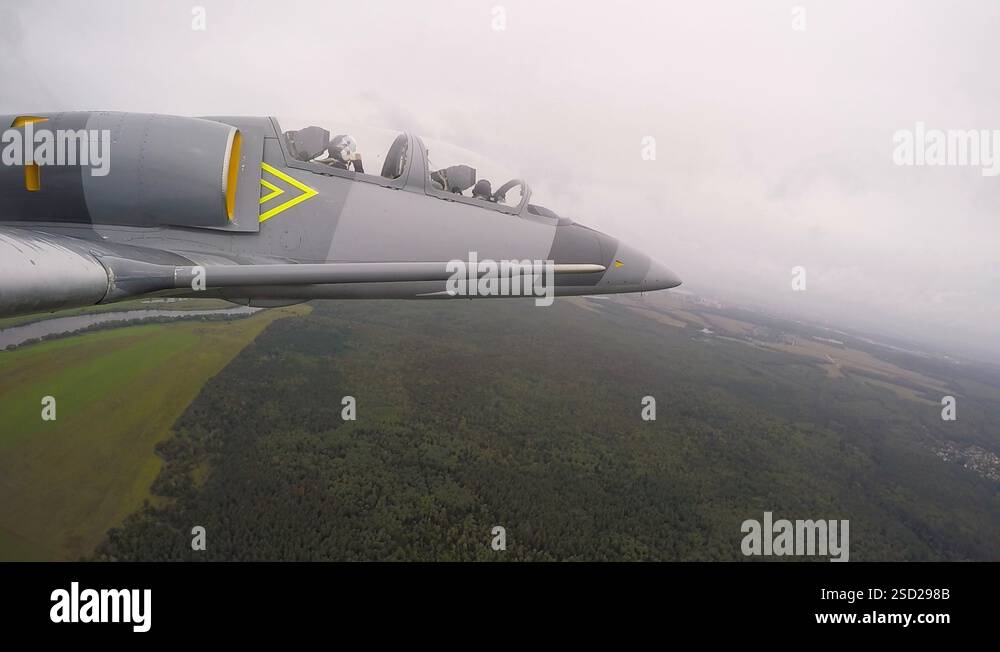 The chassis open and lowers. Gray blue fighter plane fly high in dark ...