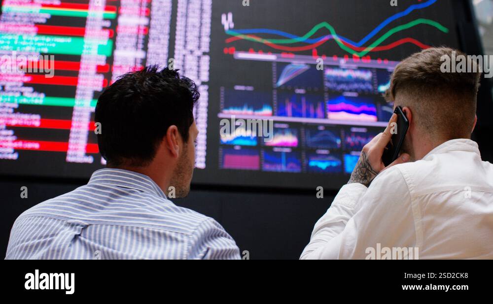 4K Stock market traders buying & selling over the phone & giving a high ...