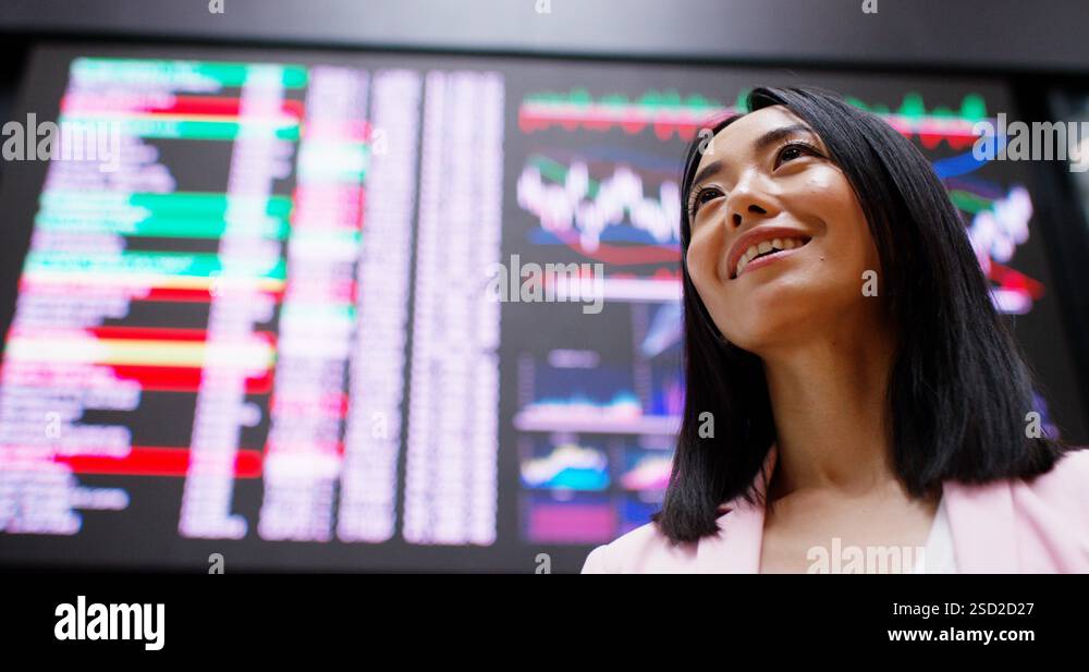 4K Young city trader looking around stock exchange floor with awe ...