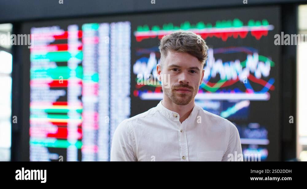 4K Zoom in to closeup smiling stockbroker with stockmarket data in ...