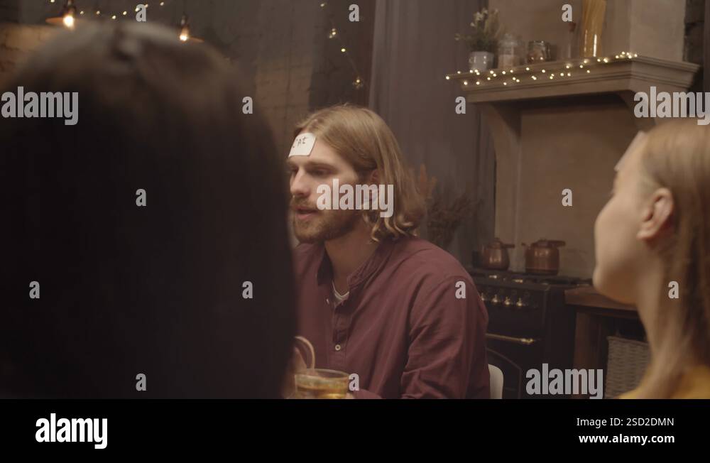 Cheerful People Playing Guessing Game at Dinner Party Stock Video ...