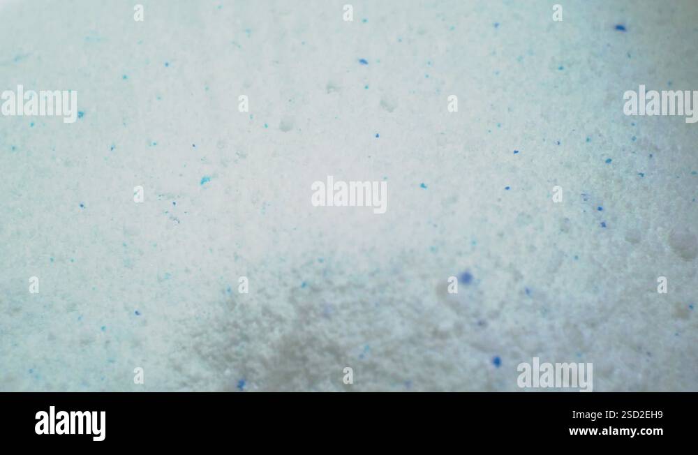 White dry washing powder is poured into the container Stock Video ...