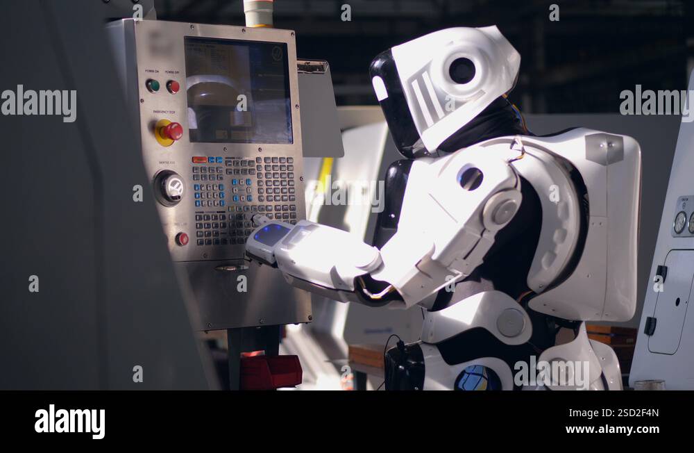 Working droid pushes on buttons on a factory machine Stock Video ...