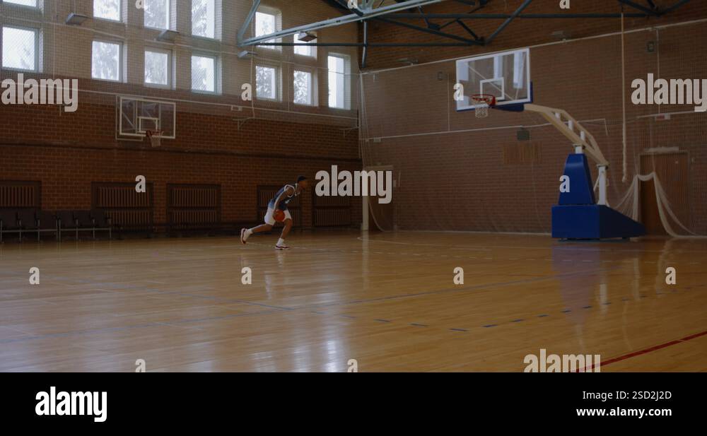 WIDE African American black basketball player practicing alley-oops ...